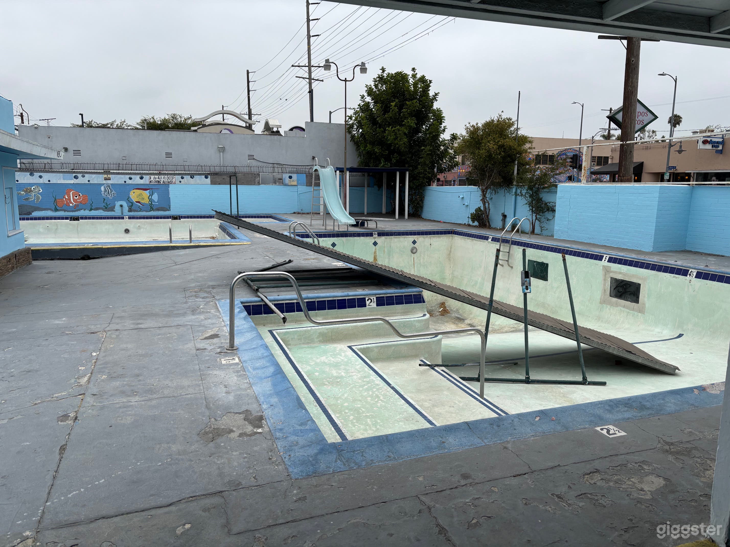 Abandoned Outdoor Pool Complex | Rent this location on Giggster